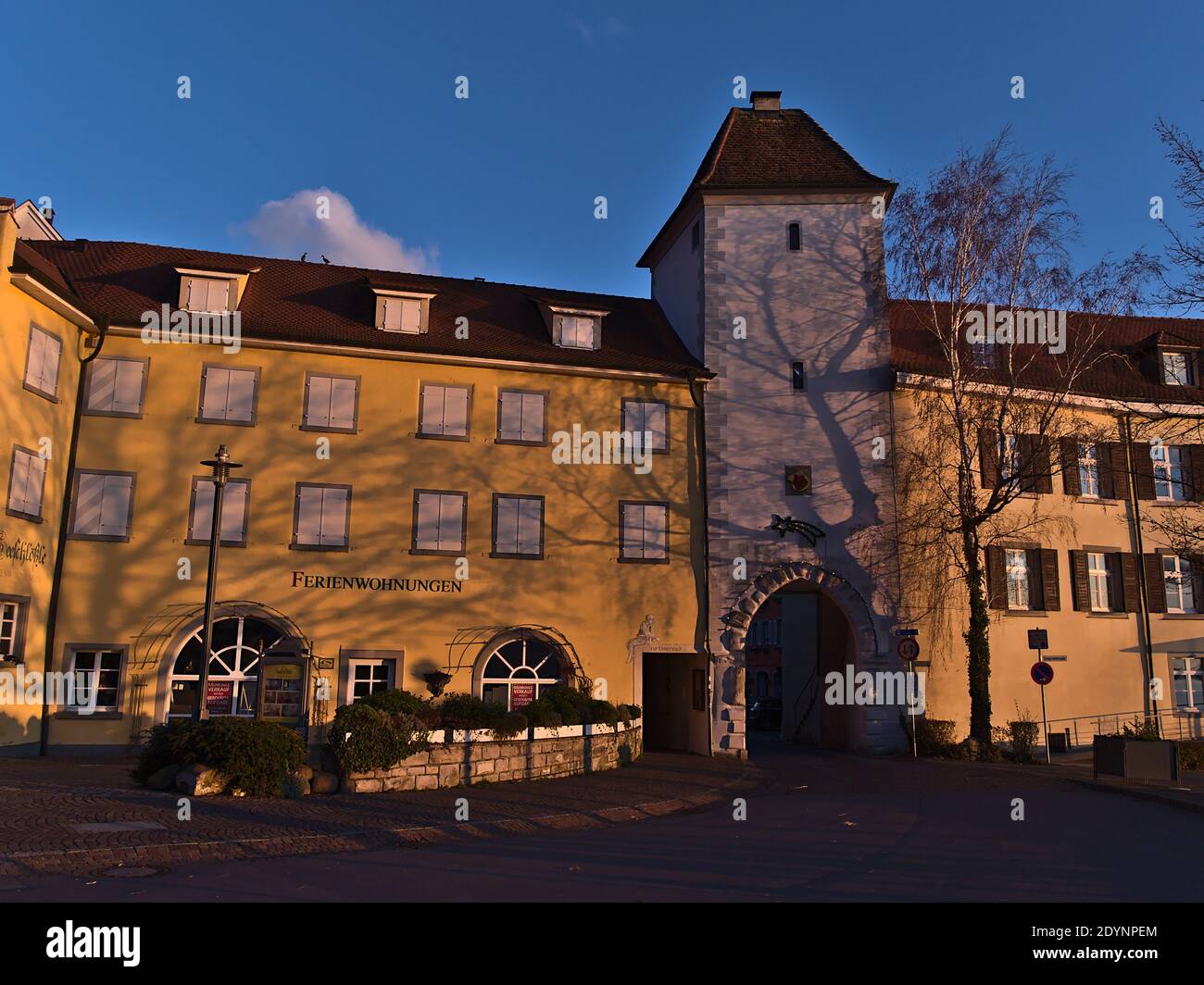 View of western town entrance with historic gate and tower ...