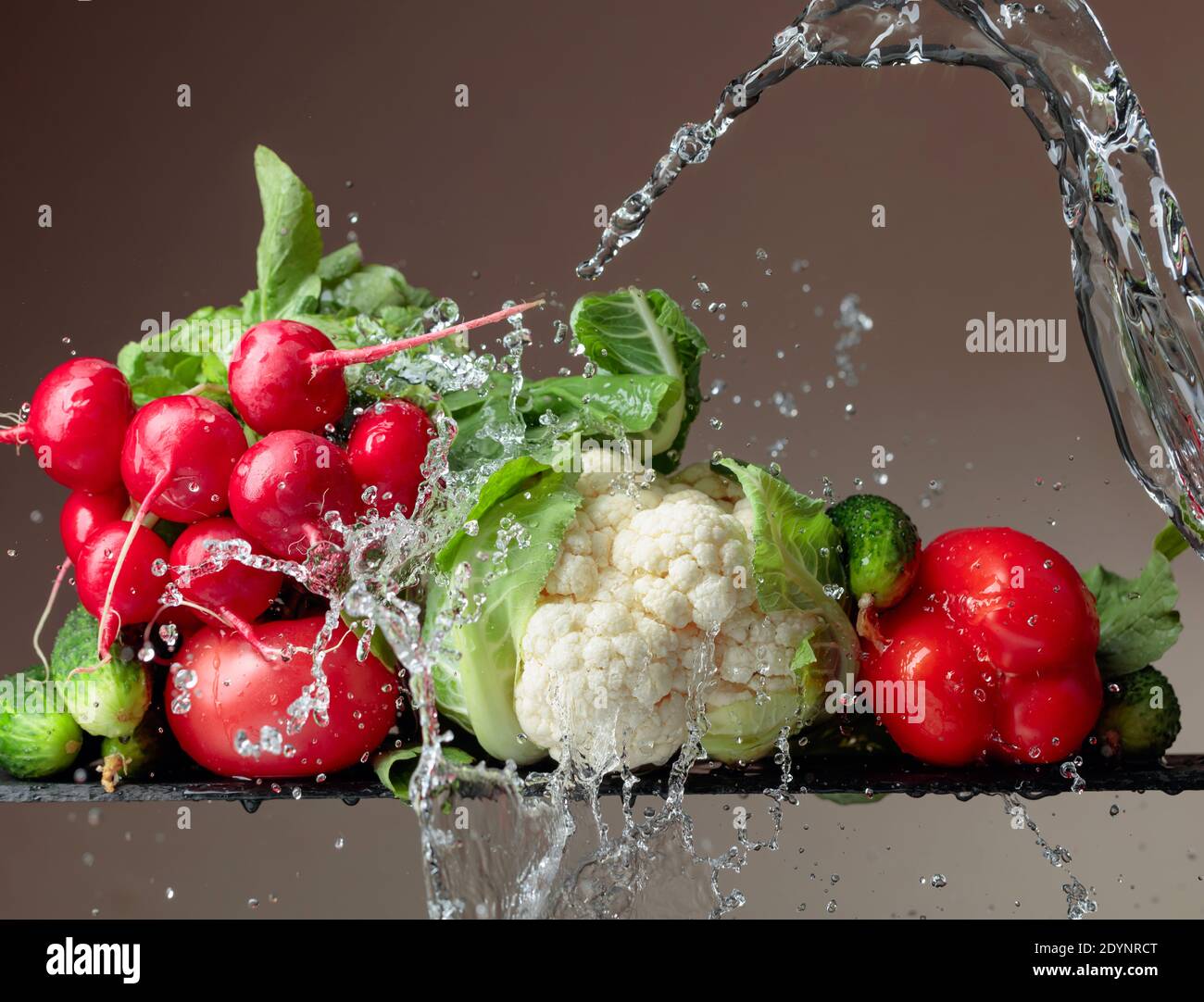 Various fresh raw vegetables with water splash. Copy space Stock Photo ...