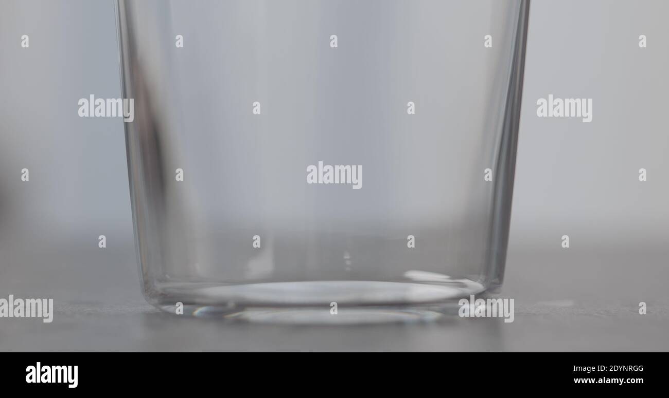 closeup tumbler glass on concrete countertop, wide photo Stock Photo ...