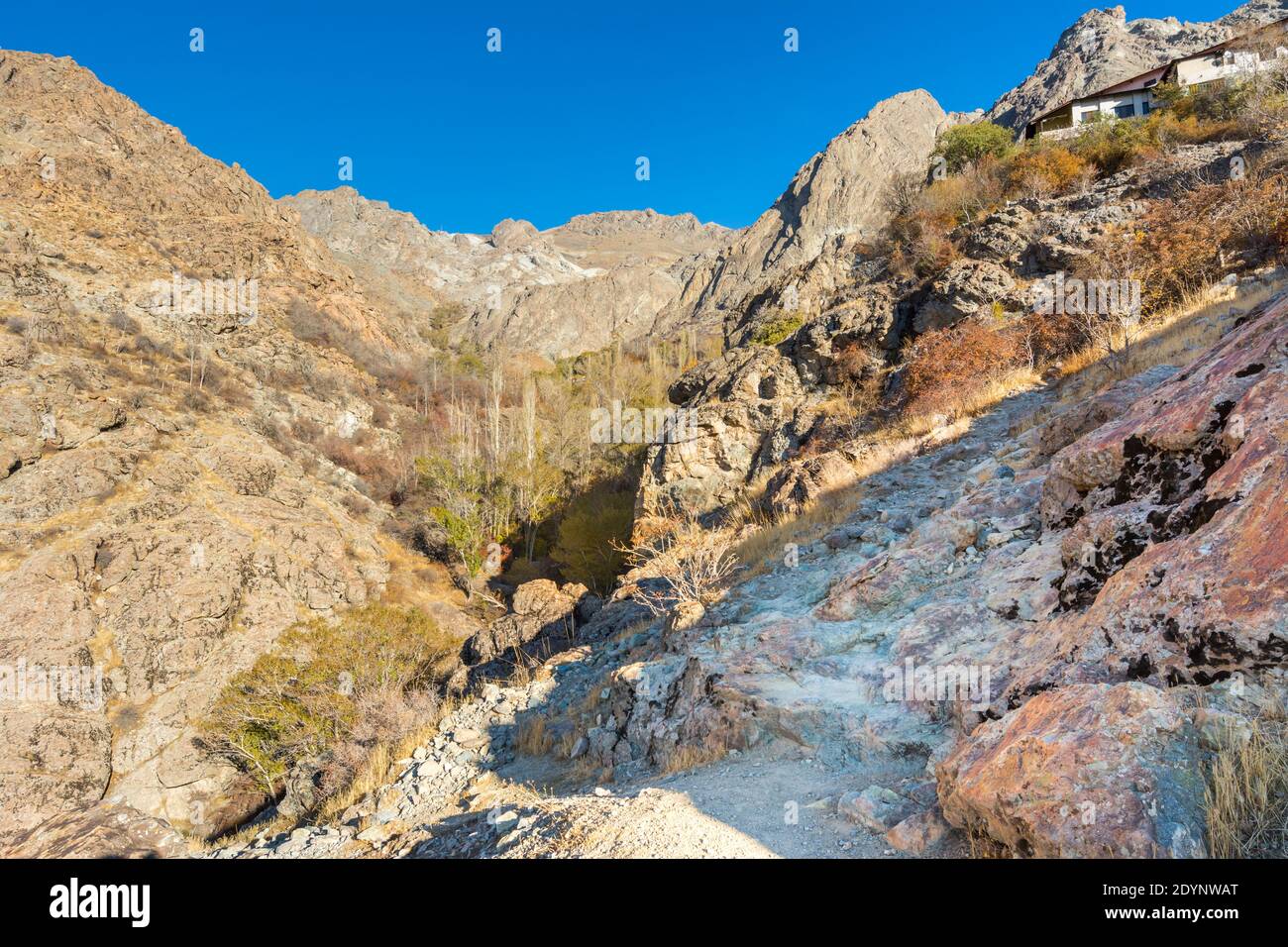 Barren mountain in Darband valley in autumn in the morning against blue ...