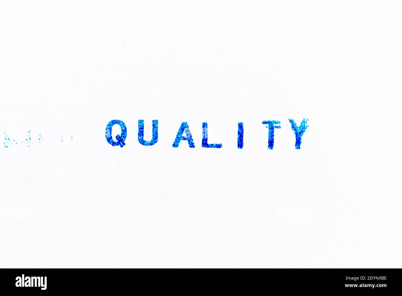 Blue color ink of rubber stamp in word quality on white paper ...