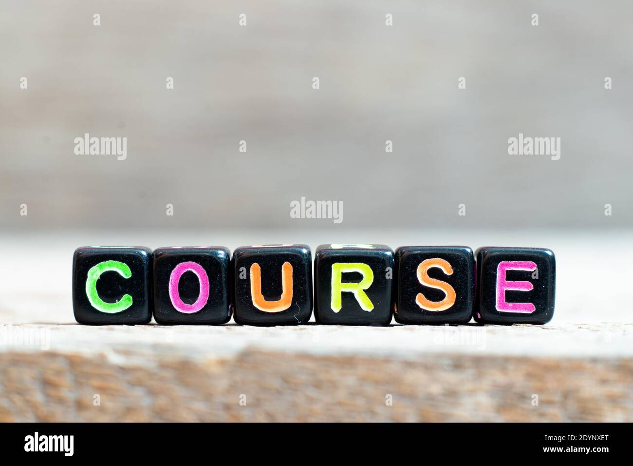 Black bead with color letter in word course on wood background Stock ...