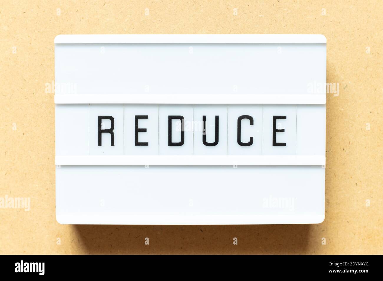 Lightbox with word reduce on wood background Stock Photo - Alamy