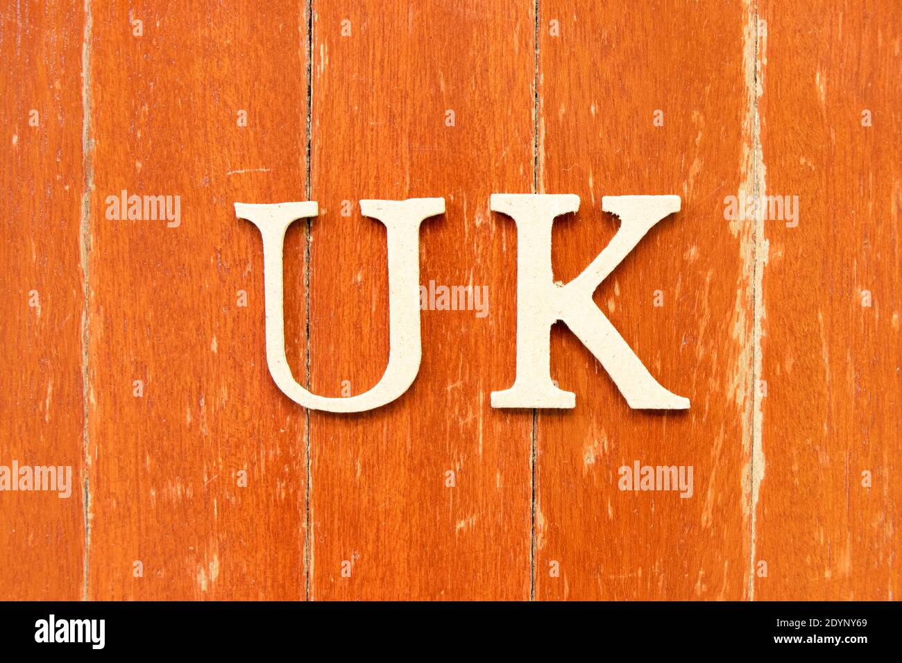 Alphabet letter in word UK (abbreviation of united kingdom) on old red ...