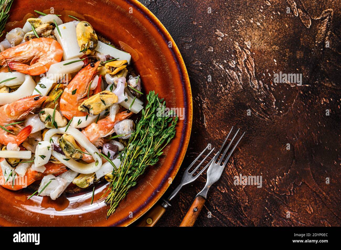 Marine seafood cocktail with shrimps, prawns, mussels, squids and ...