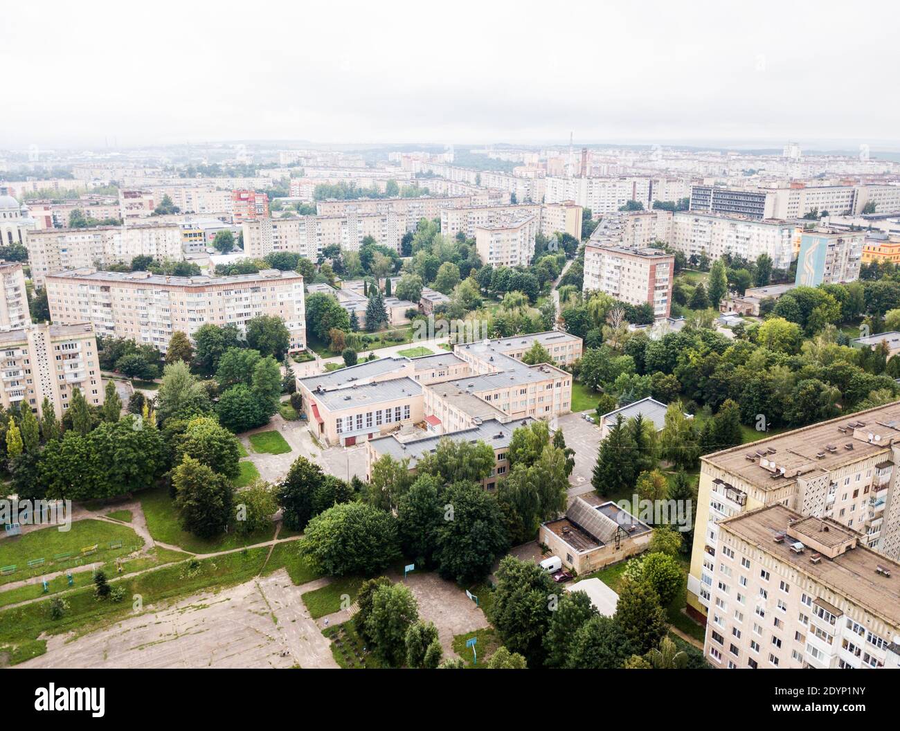 Aerial view of town with socialist soviet panel building at cloudy day ...