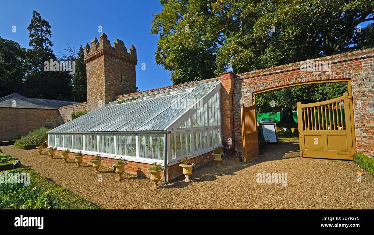 Greenhouse wall gate and tower at Oxburgh hall Norfolk Stock Photo - Alamy