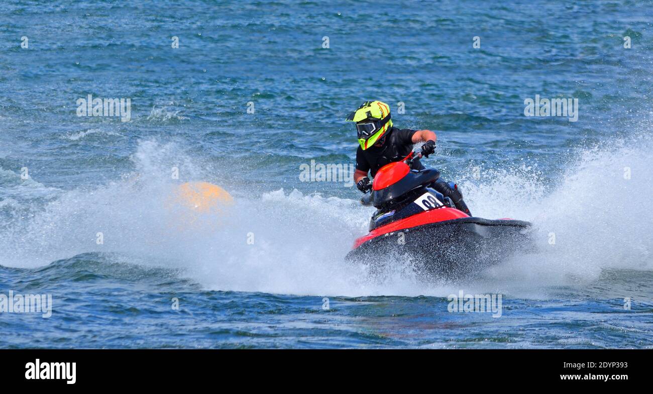 Jet Ski racer creating at lot of spray black and red jet-ski Stock ...