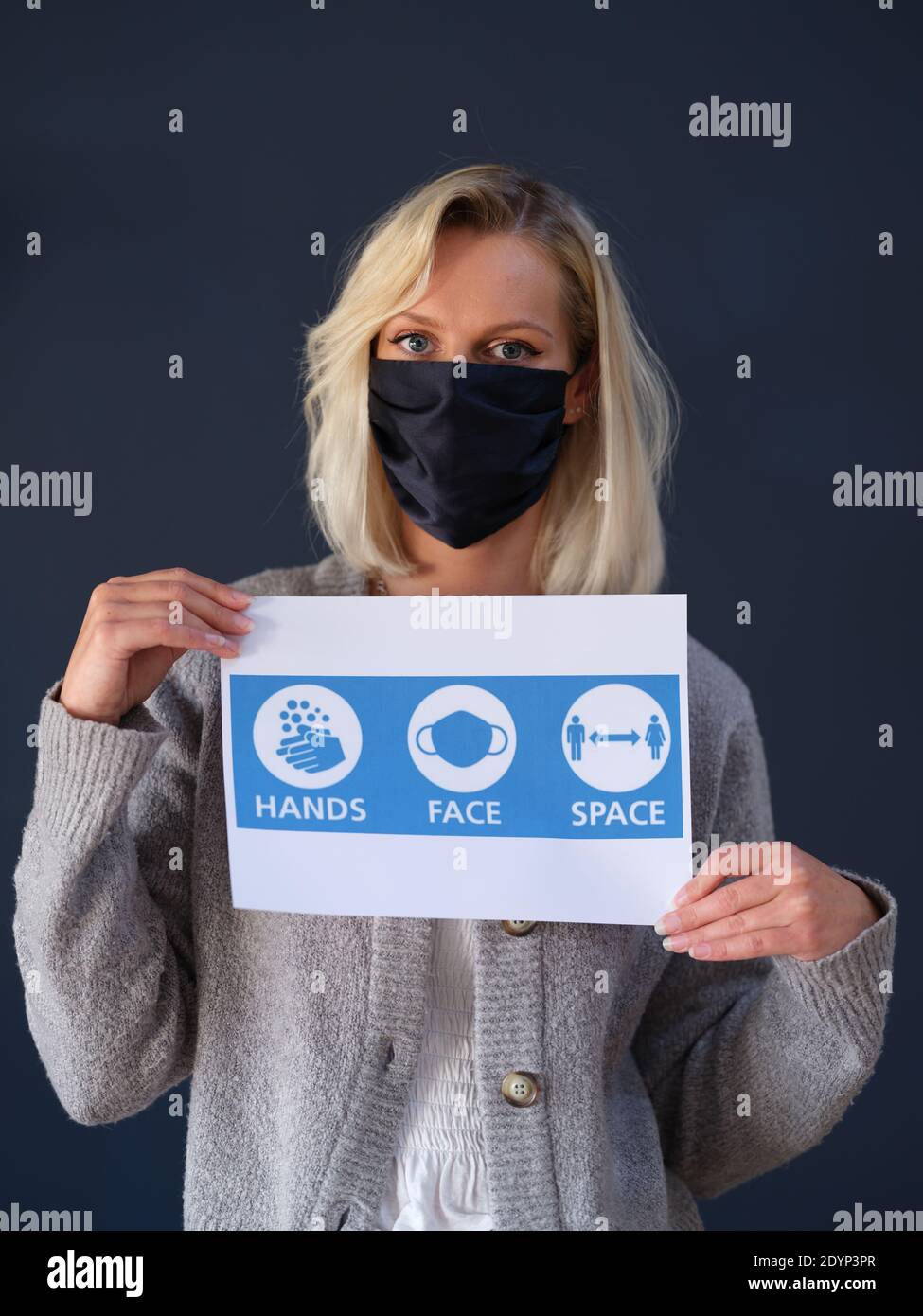 Portraits of Girl wearing Covid Coronavirus Mask holding NHS sign and ...