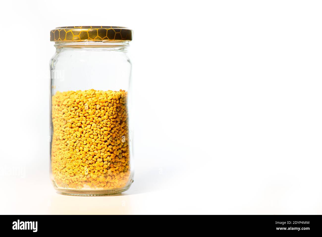 Glass jar with Italian bee pollen on white background Stock Photo - Alamy