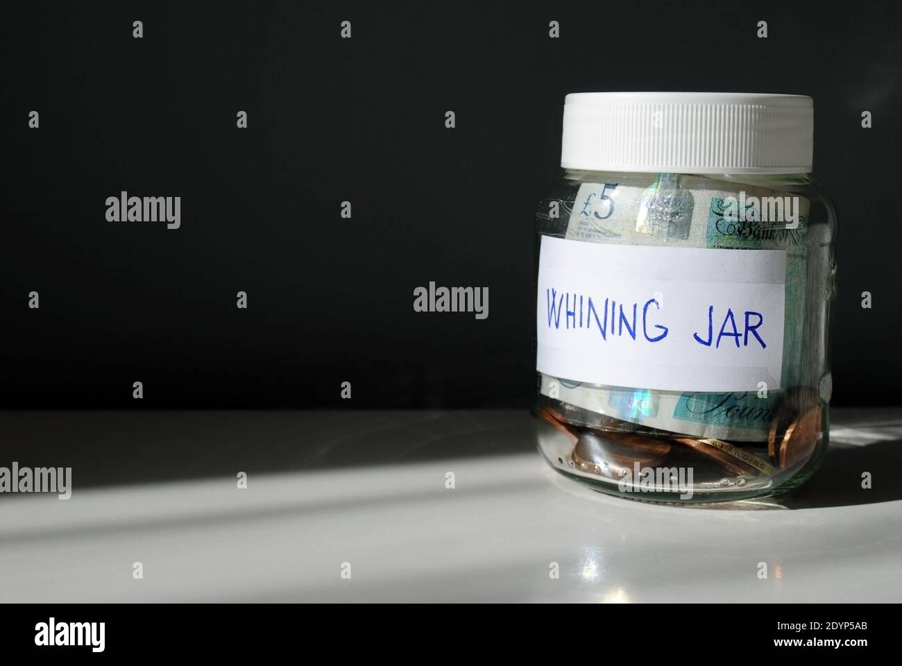 Glas with coins hi-res stock photography and images - Alamy