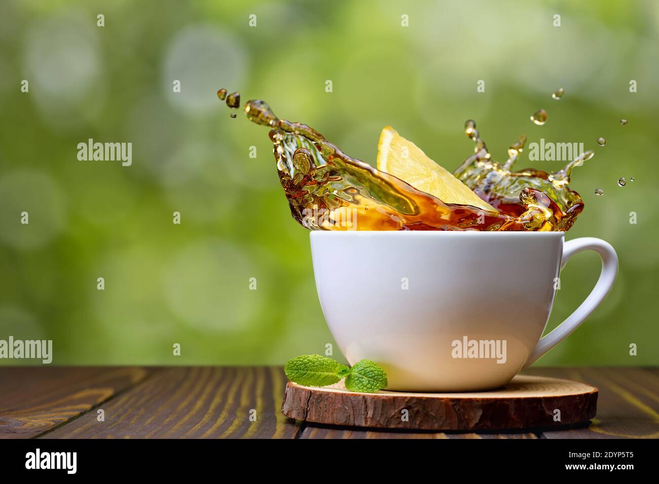cup with tea splash Stock Photo - Alamy