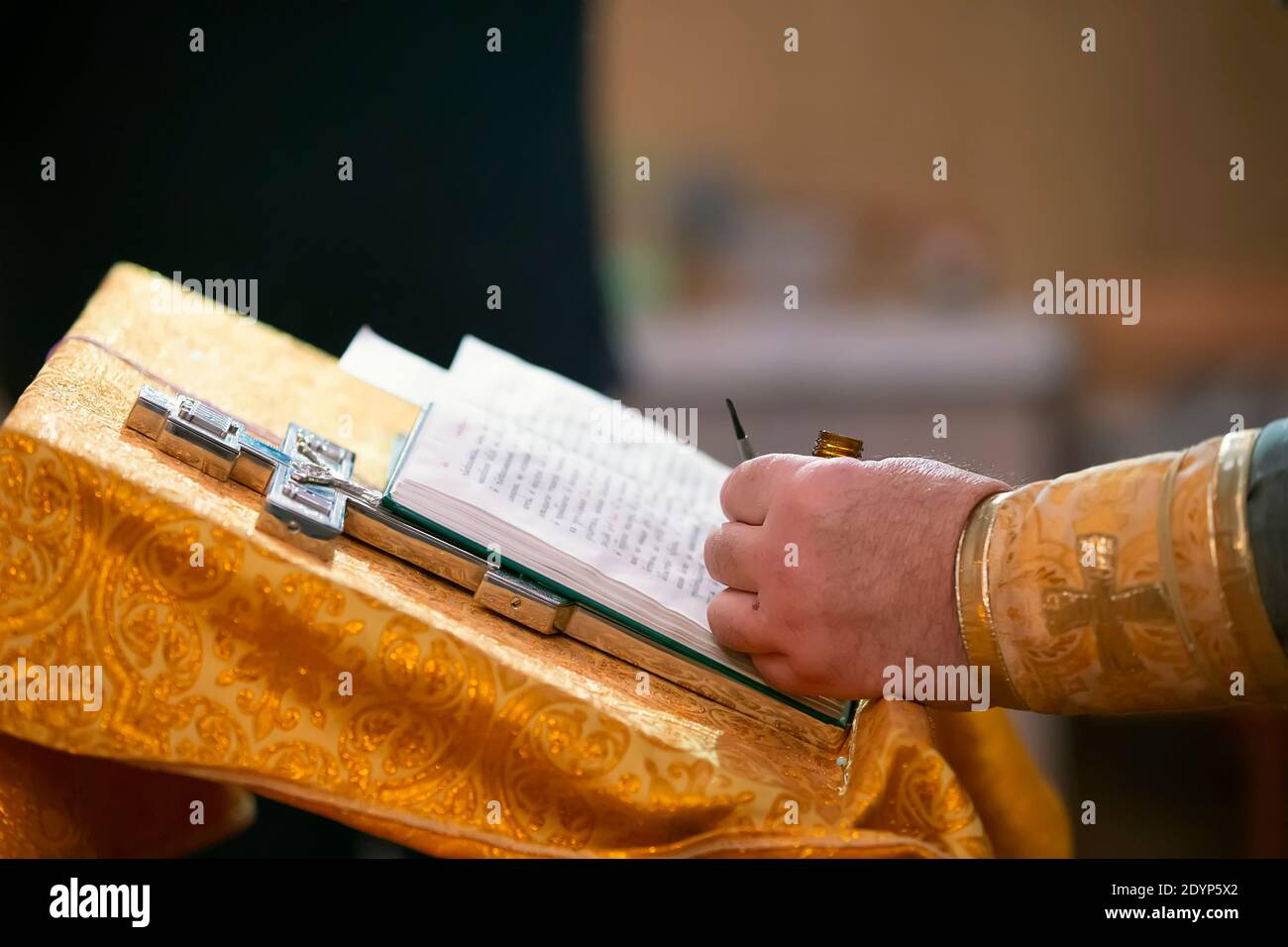 Religious background. Priest hands cross and bible Stock Photo - Alamy