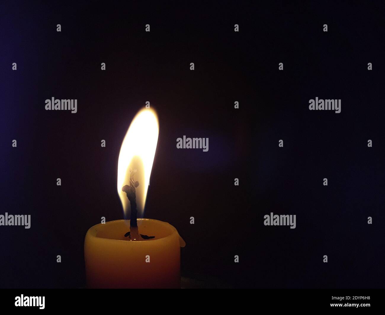 A single candle in dark Stock Photo - Alamy