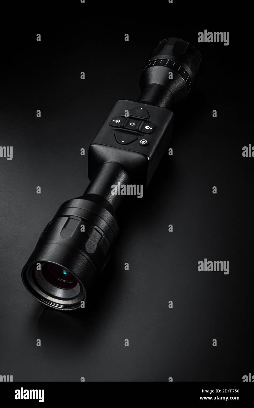 Modern sniper scope on a dark background. Optical device for aiming and ...