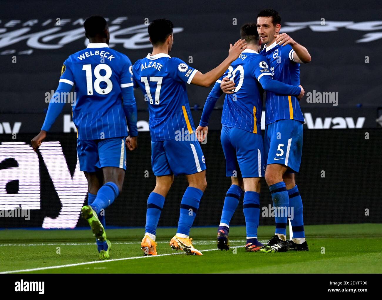 Brighton and Hove Albion's Lewis Dunk (right) celebrates scoring his ...