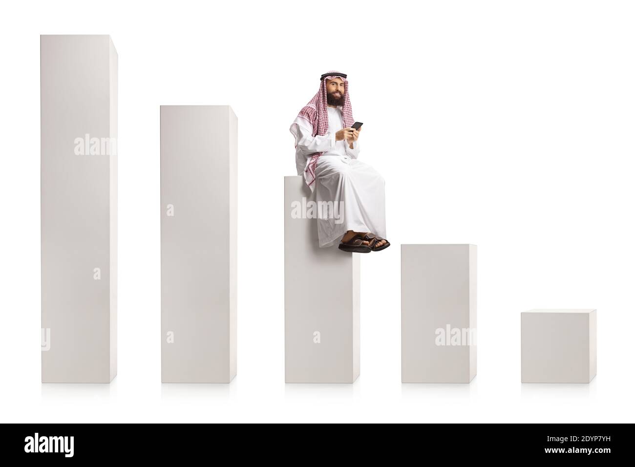 Saudi arab man using a smartphone and sitting on a white column chart ...