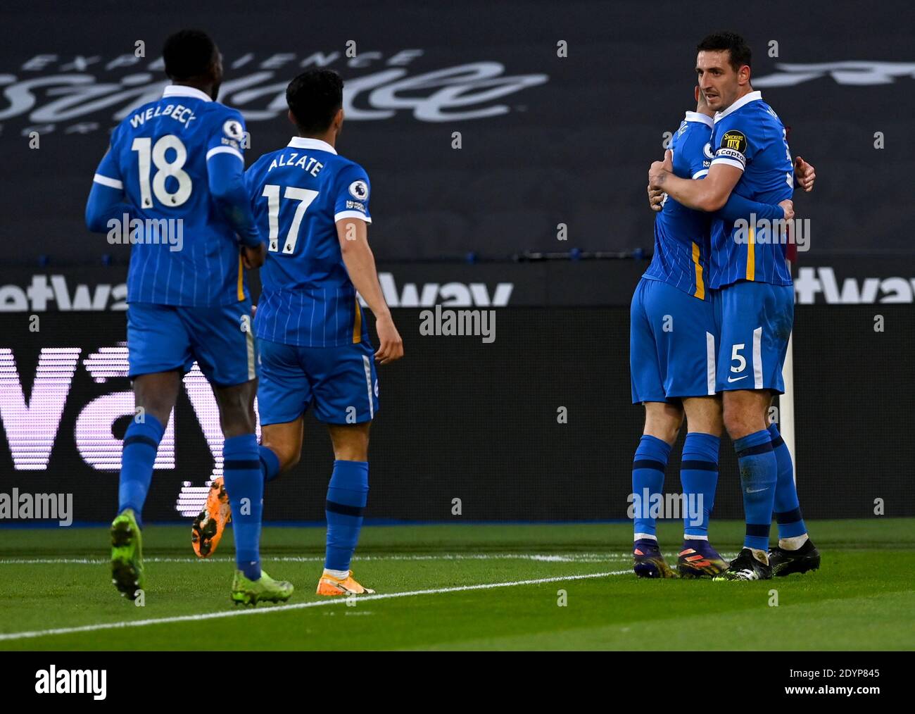 Brighton and Hove Albion's Lewis Dunk (right) celebrates scoring his ...