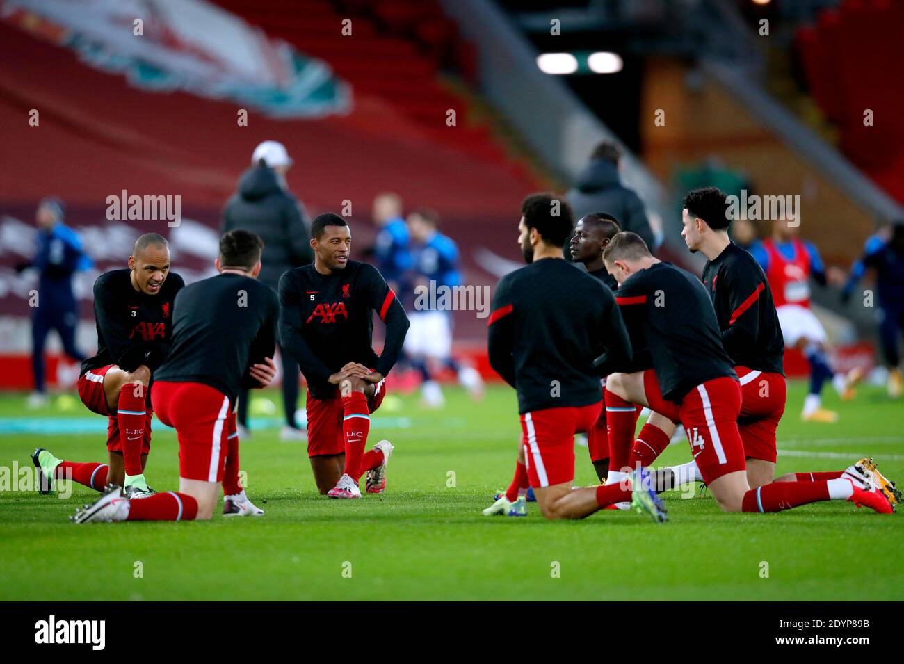 Liverpool players warm up on the pitch prior to the beginning of the Premier League match at ...