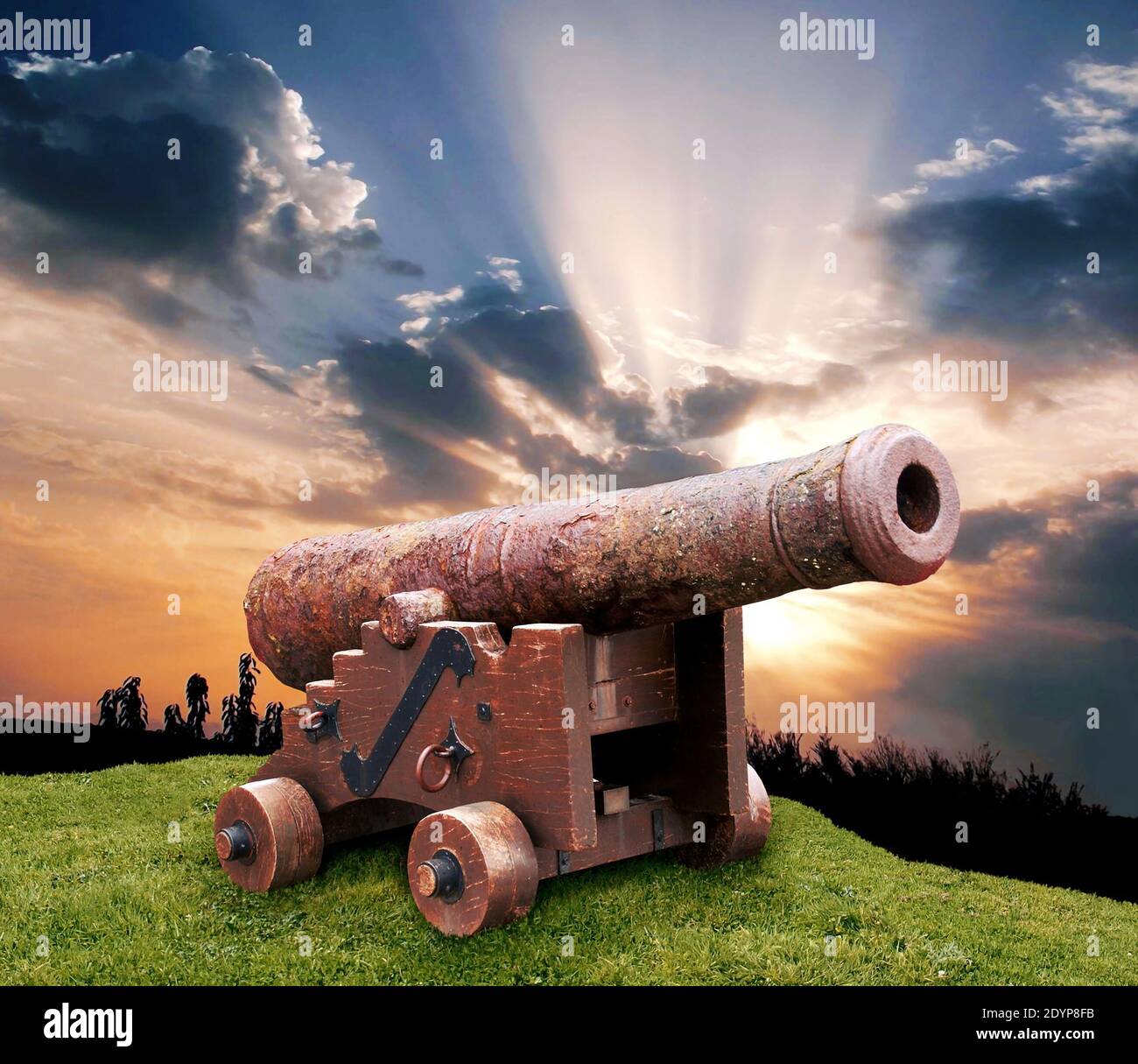 Old rusty cannon on sky background evoking violence Stock Photo - Alamy