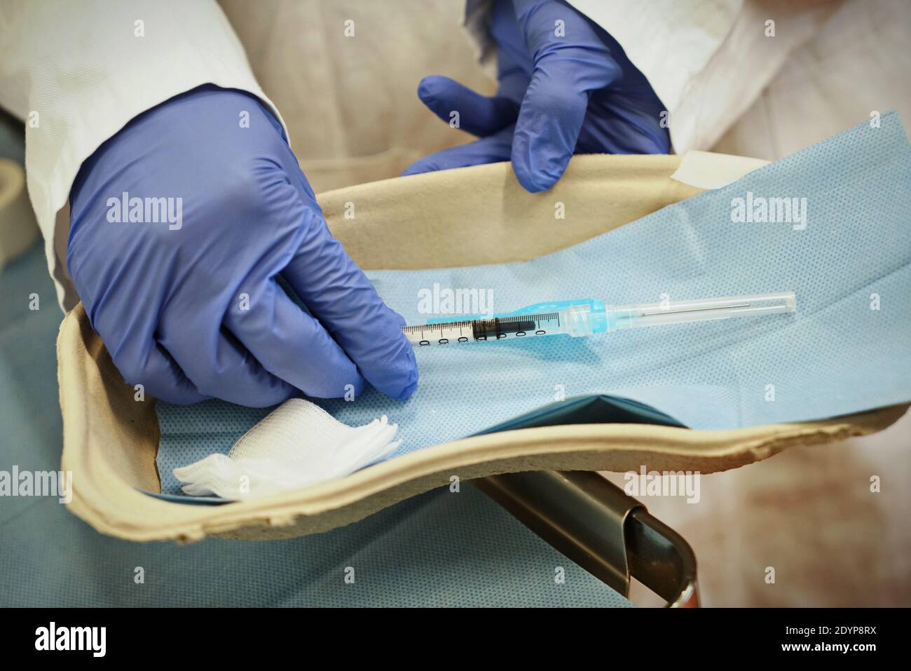 Closeup hand of woman doctor wearing face mask protective in lab hold ...