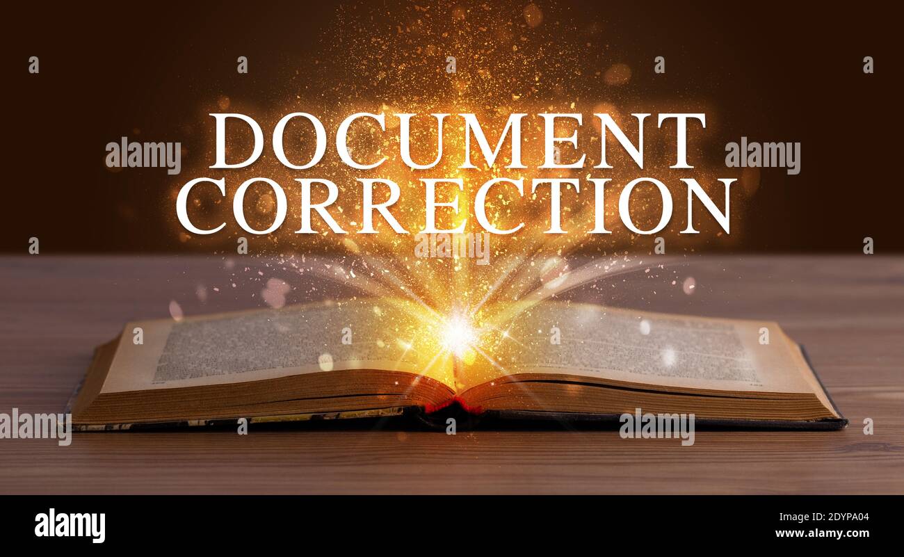 DOCUMENT CORRECTION inscription coming out from an open book ...