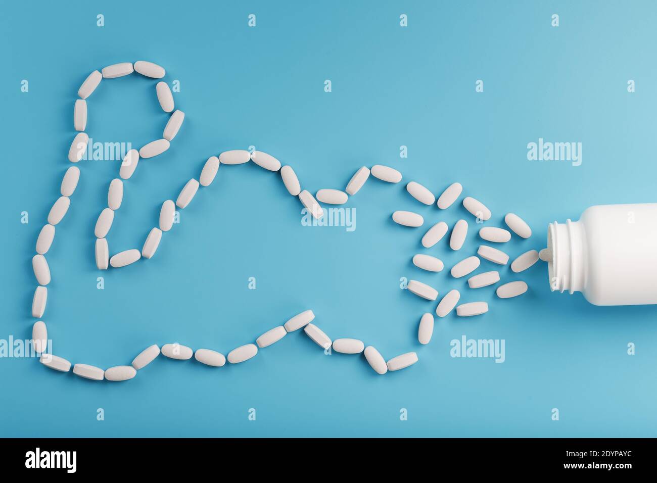 Vitamins in the form of biceps muscles on a blue background. Supplement ...