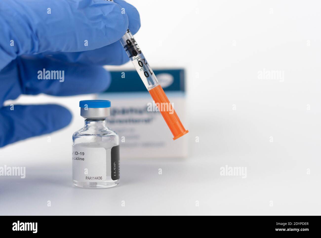 Human fingers in gloves, syringe and Covid-19 vaccine vial Stock Photo ...