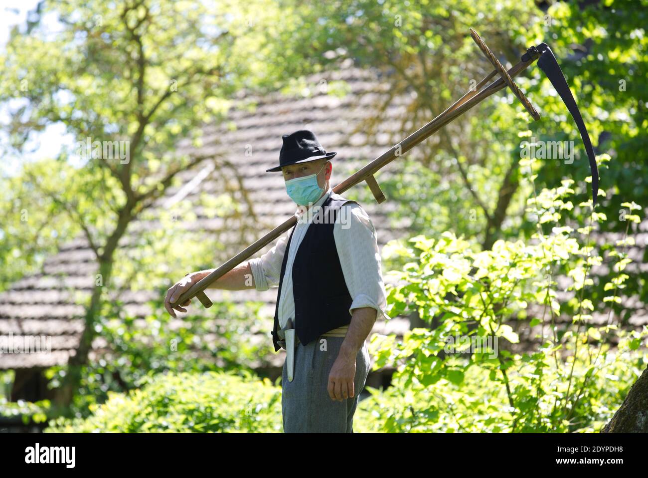 Farmer cutting grass with a scythe hi-res stock photography and images ...
