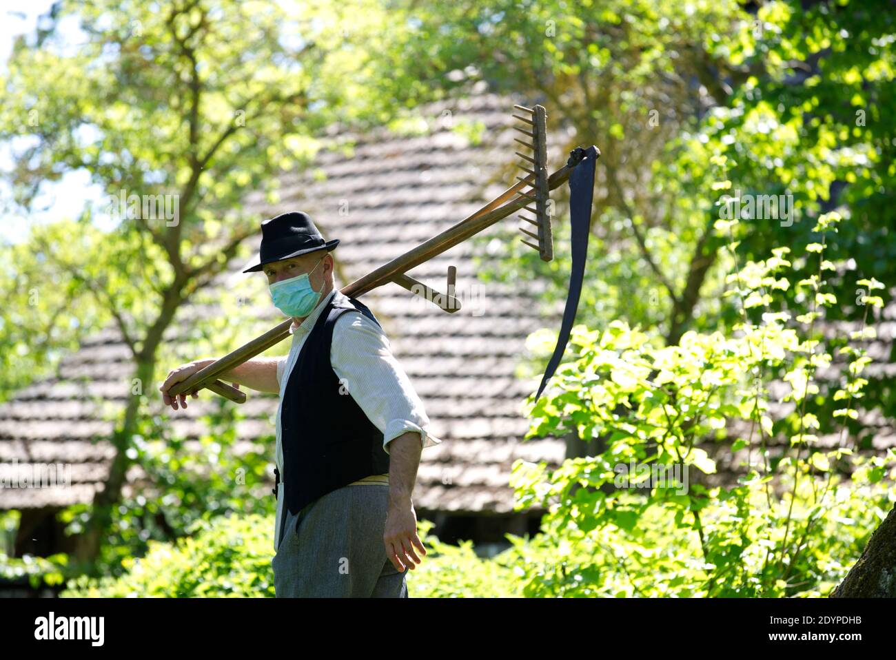 Farmer cutting grass with a scythe hi-res stock photography and images ...