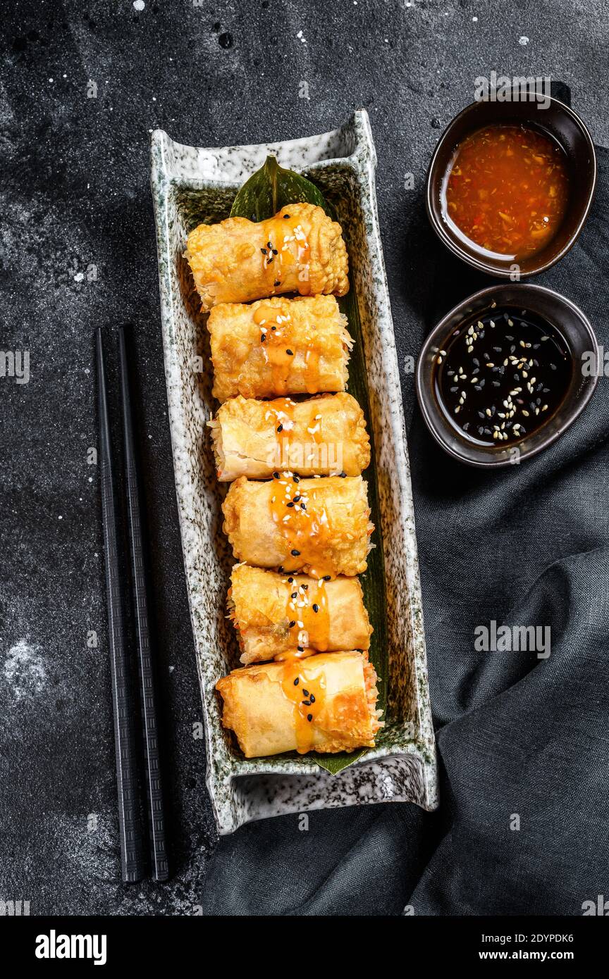Fried spring rolls. Black background. Traditional Chinese cuisine. Top ...