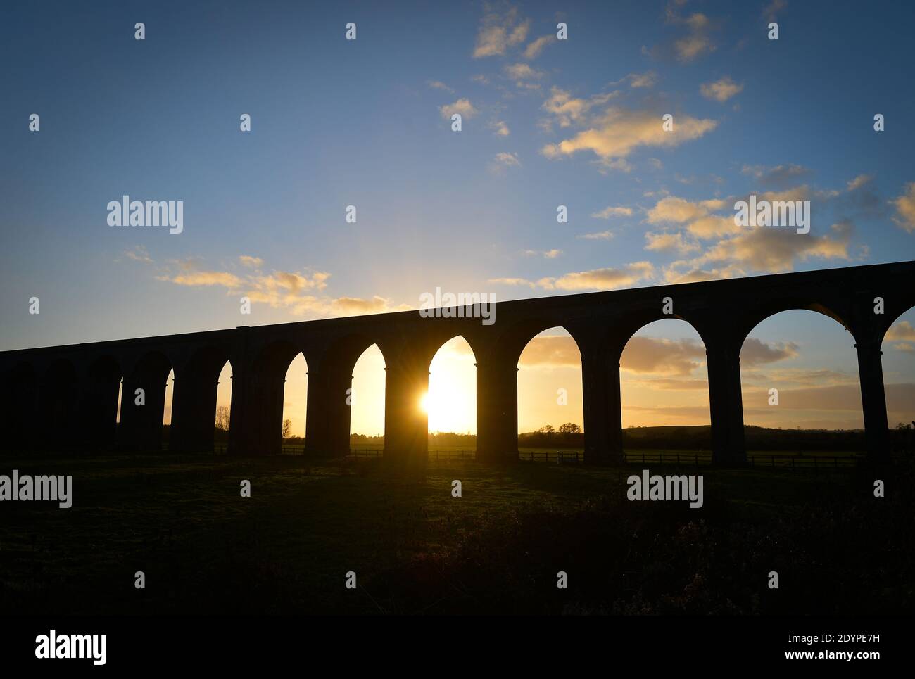 The sun sets behind Harringworth Viaduct also known as the Welland ...