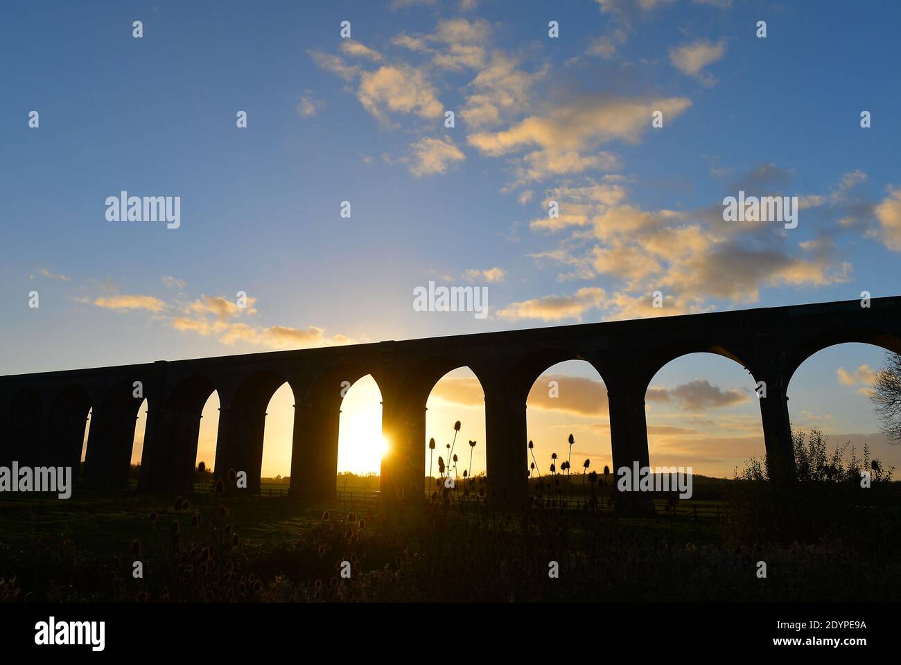 The sun sets behind Harringworth Viaduct also known as the Welland ...