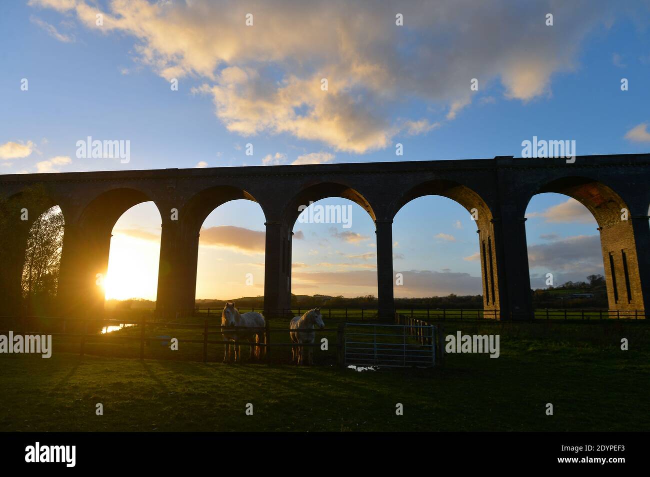 The sun sets behind Harringworth Viaduct also known as the Welland ...