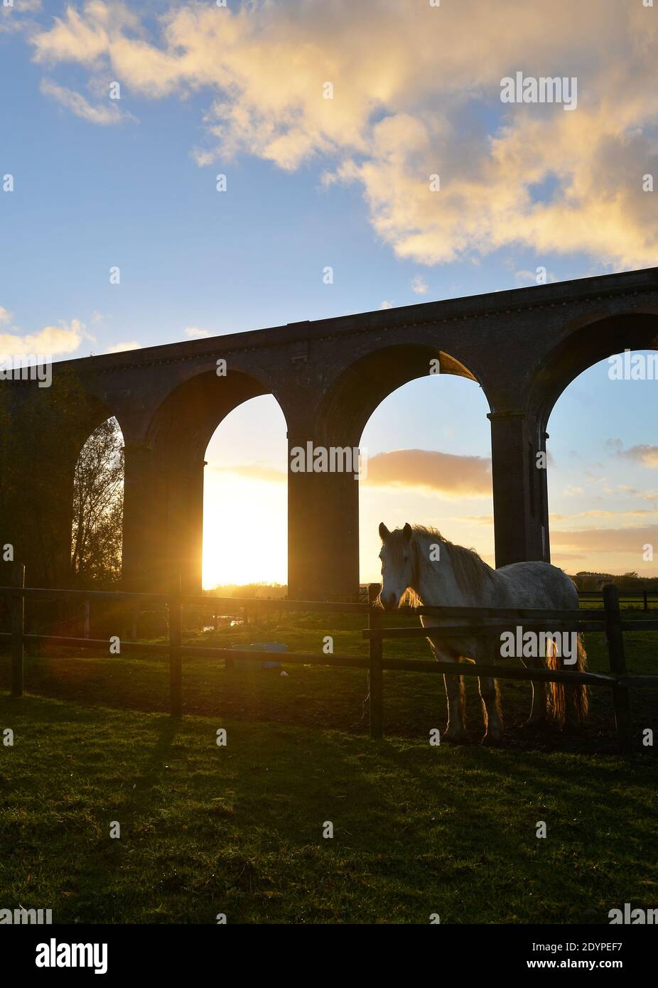 The sun sets behind Harringworth Viaduct also known as the Welland ...