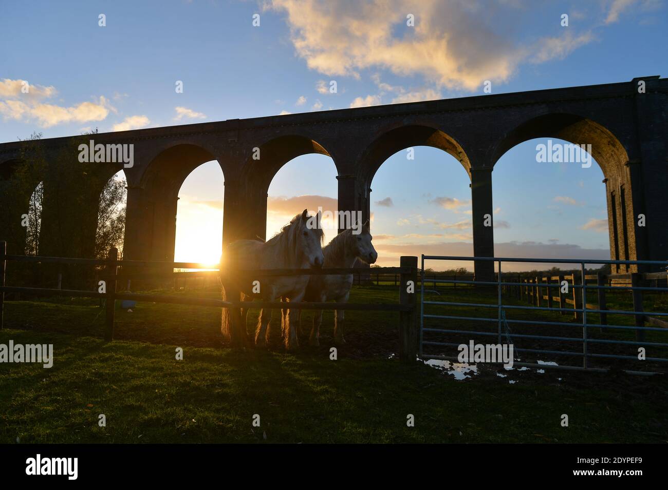 The sun sets behind Harringworth Viaduct also known as the Welland ...