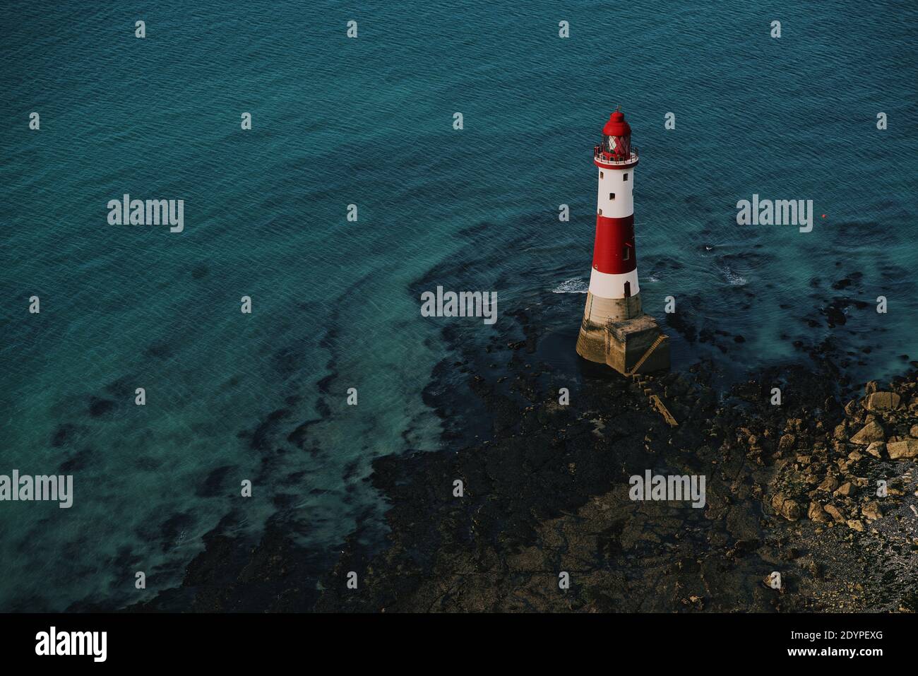 Beautiful picture of the Red and White old lighthouse on the sea Stock ...