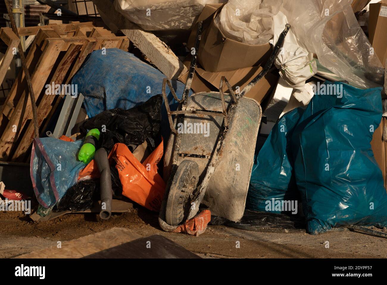 Rubbish from demolition. Wheelbarrow and rubbish. Construction site ...