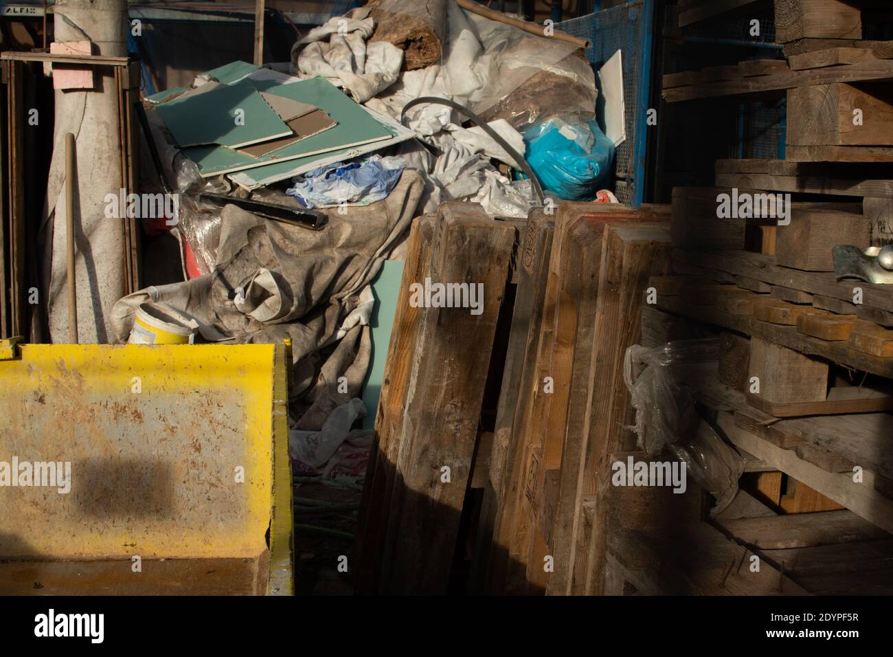 Rubbish from demolition. Construction pallets and rubbish. Construction ...