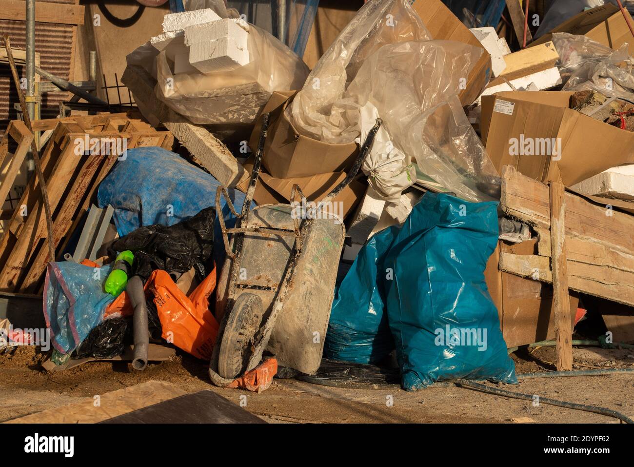 Rubbish from demolition. Wheelbarrow and rubbish. Construction site ...