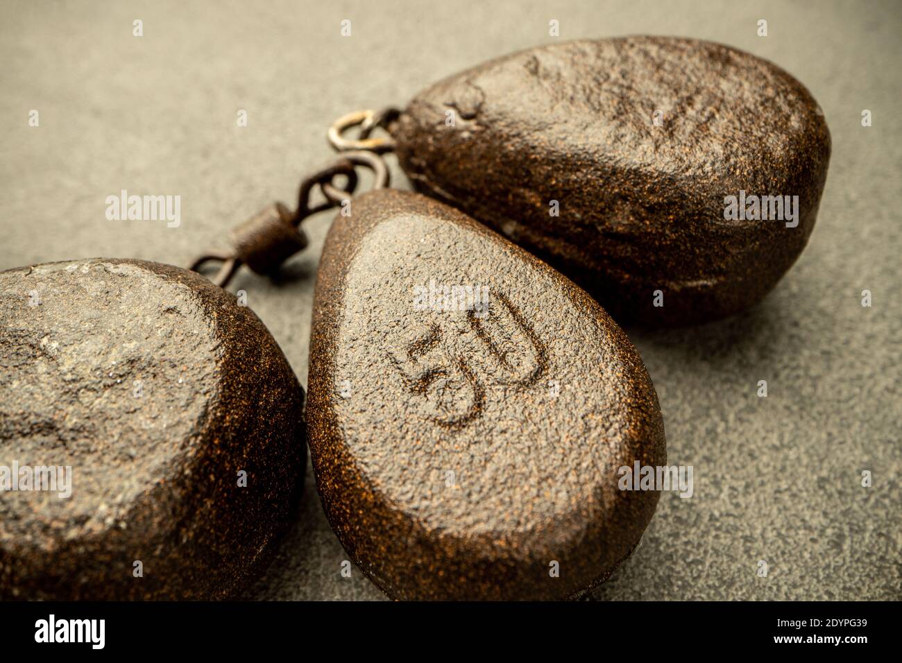 Lead weight for fishing close up photo Stock Photo - Alamy