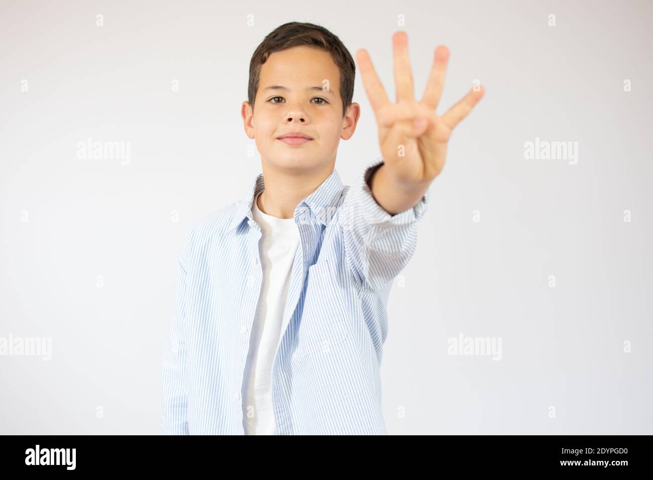 Handsome toddler child with brown eyes raising finger, is the number ...