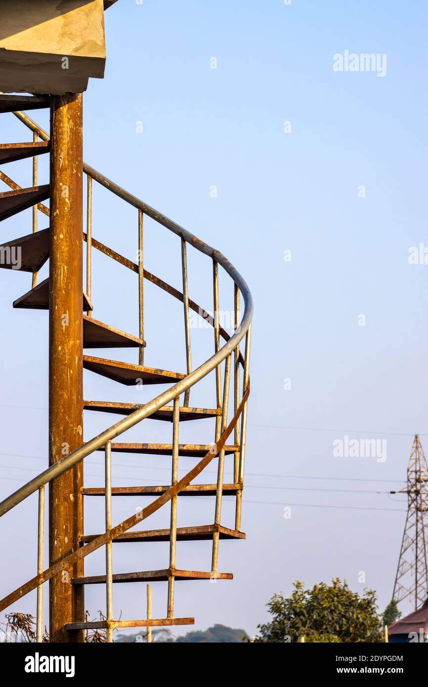 Twisted iron stairs of a watchtower inside of an industrial project ...