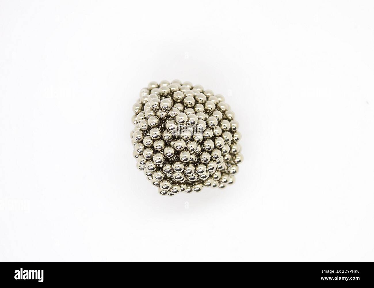 Shape made of metal sphere segments on white background Stock Photo - Alamy