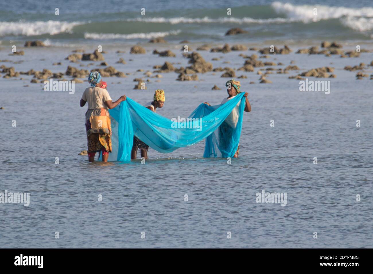 Silhouettes of African Woman catching fish with net, traditional rural ...
