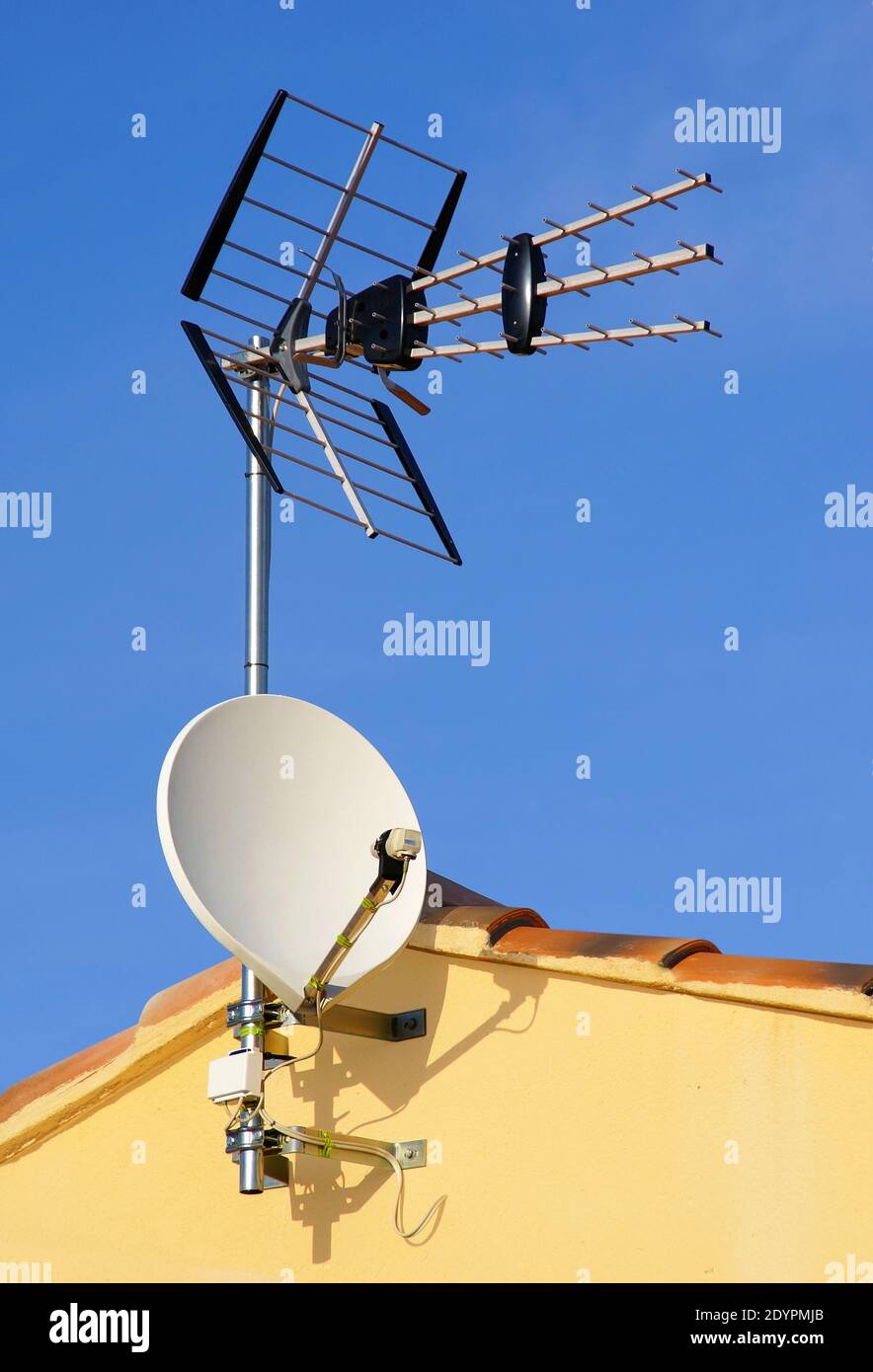 Satellite dish on blue sky background Stock Photo - Alamy