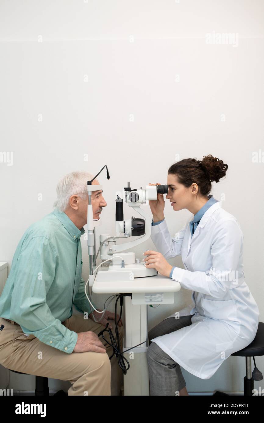 Side view ophthalmologist working hi-res stock photography and images ...