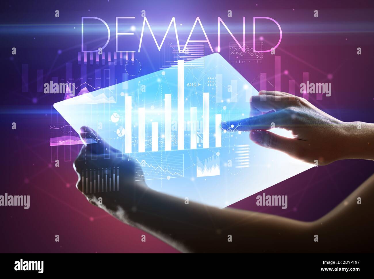 Hand holding futuristic tablet with DEMAND inscription above, modern ...