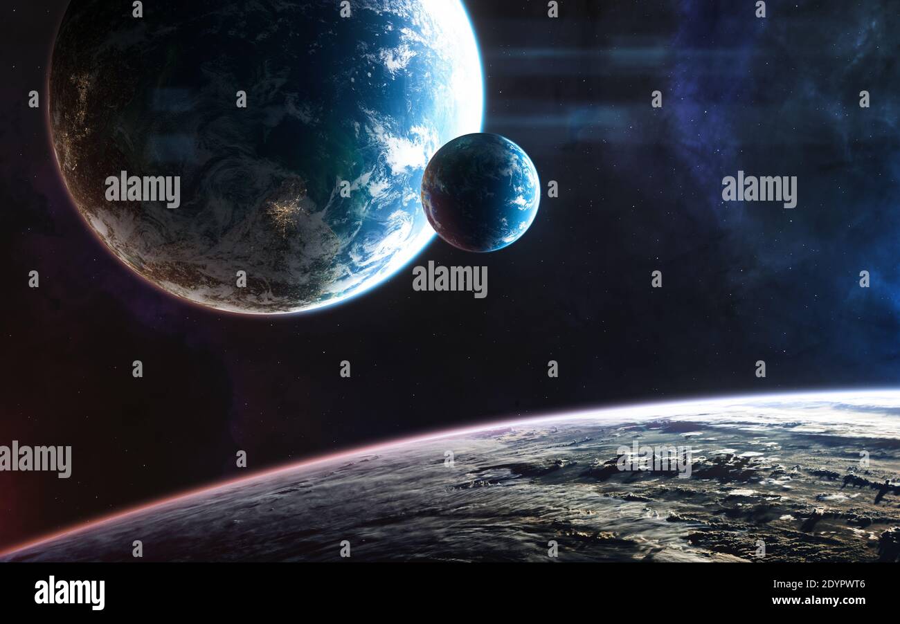 Inhabited planets in deep space in light of blue star Stock Photo - Alamy