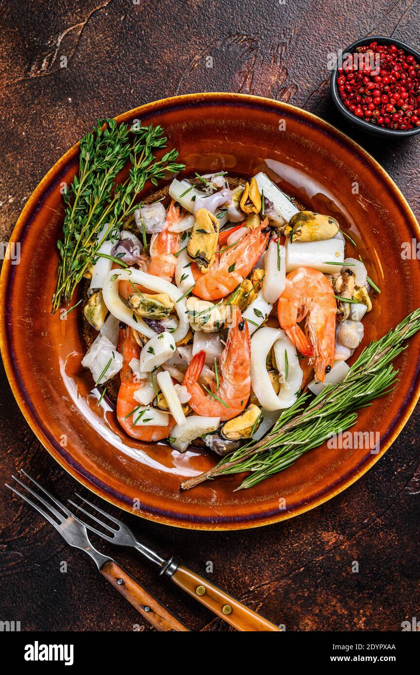 Marine seafood cocktail with shrimps, prawns, mussels, squids and ...